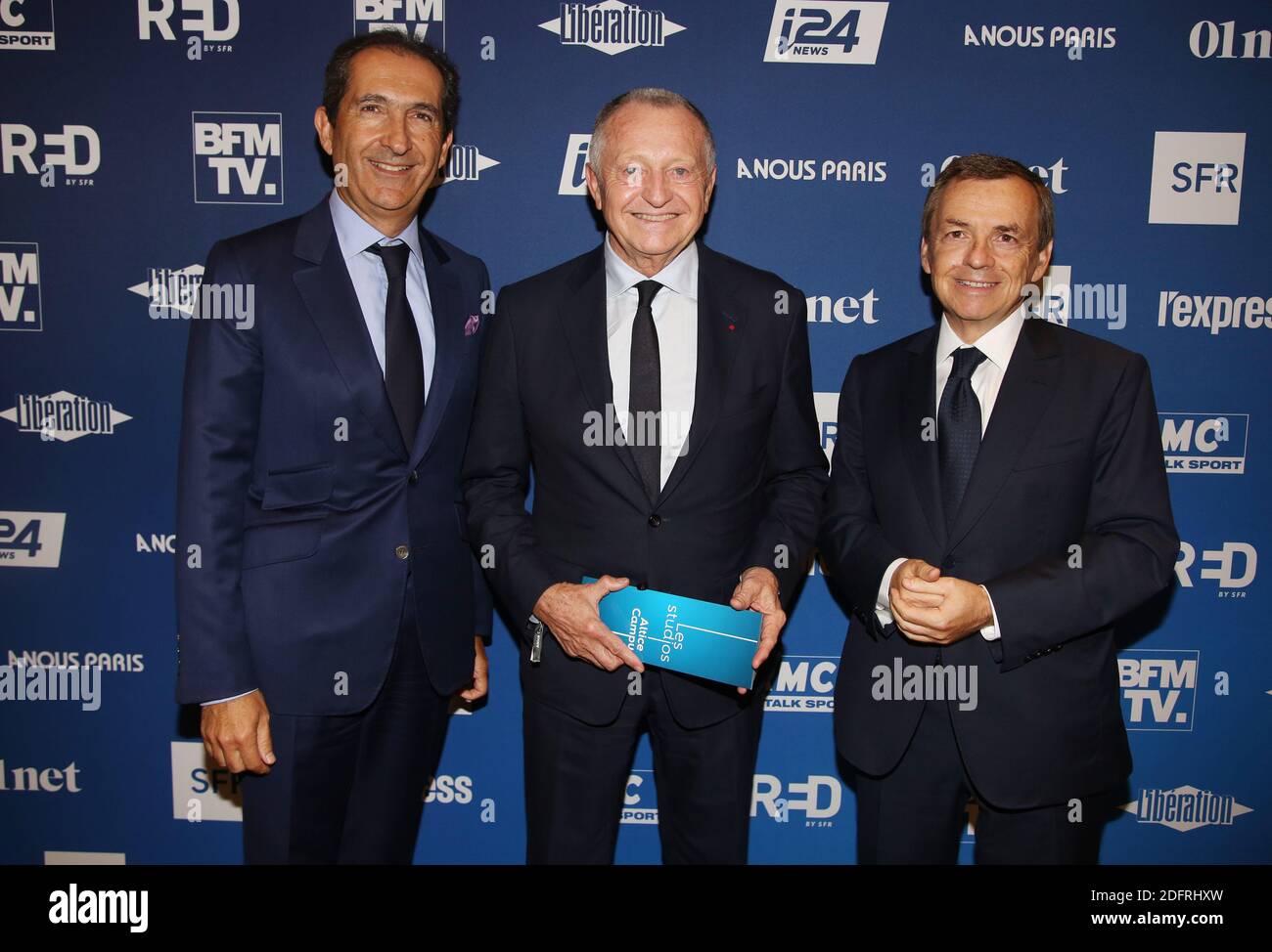 Patrick Drahi, Jean-Michel Aulas and Alain Weill attending Altice ...