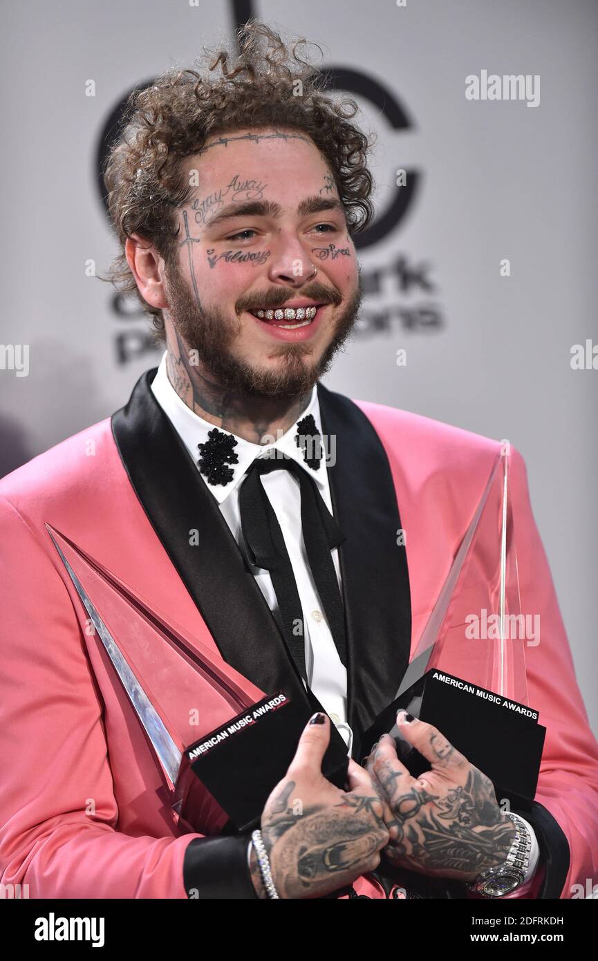 Post Malone poses in the press room during the 2018 American Music ...