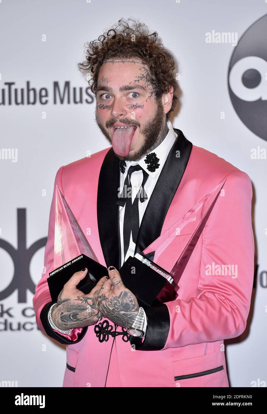 Post Malone poses in the press room during the 2018 American Music ...