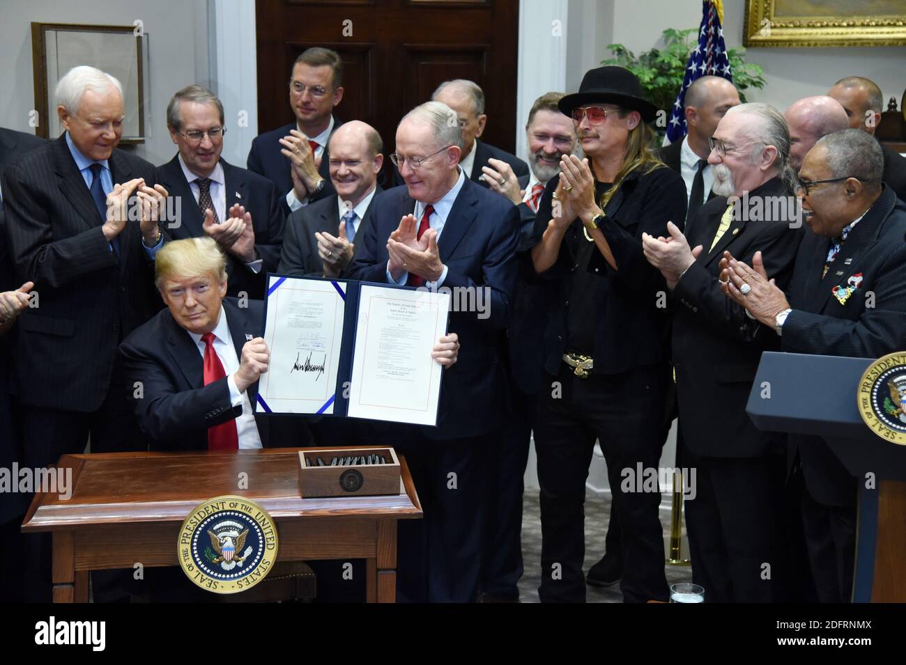 U.S. President Donald Trump signs the Music Modernization Act into law ...