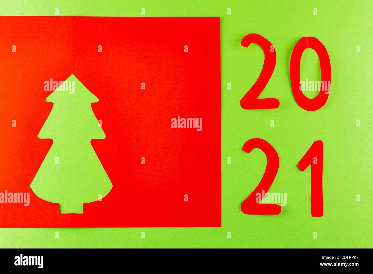 Christmas tree on a red green background. New Year's concept 2021 ...