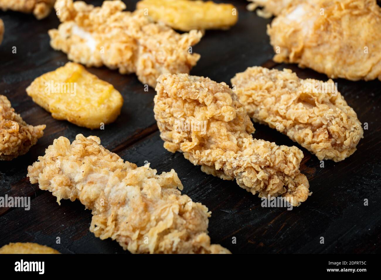 Southern fried chicken cuts on dark wooden background Stock Photo - Alamy