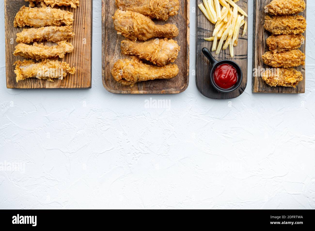 Southern fried chicken cuts on white background, top view, with space ...