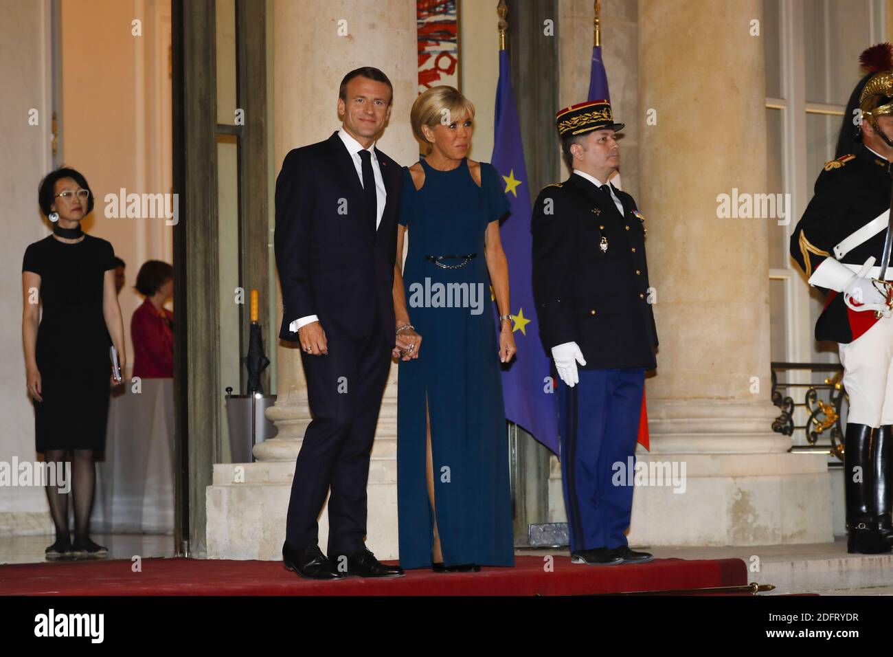French President Emmanuel Macron and his wife Brigitte Macron greets ...