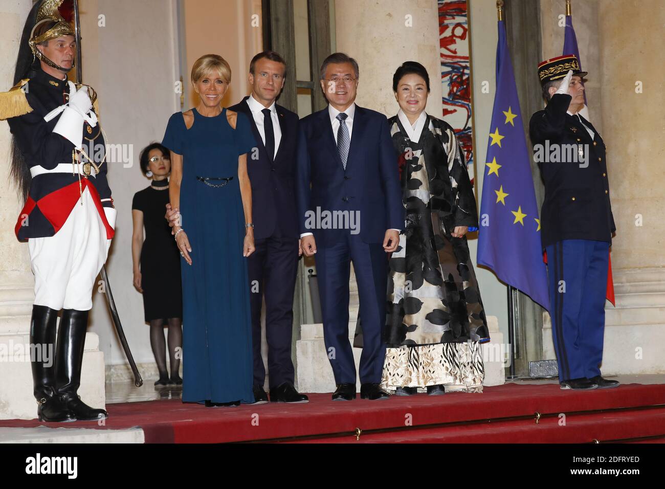French President Emmanuel Macron and his wife Brigitte Macron greets ...