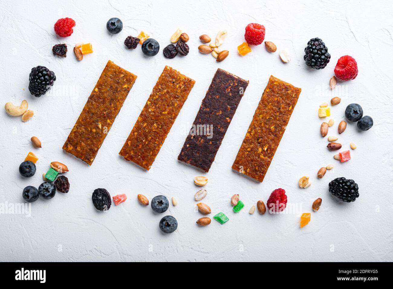 Fruit berry nut energy bars, healthy snack, flat lay, on white ...