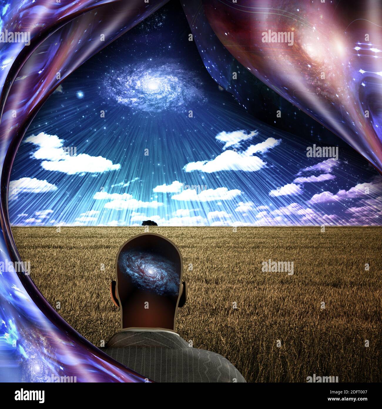 Man with galaxy inside his head stands on a field of wheat. Shining ...