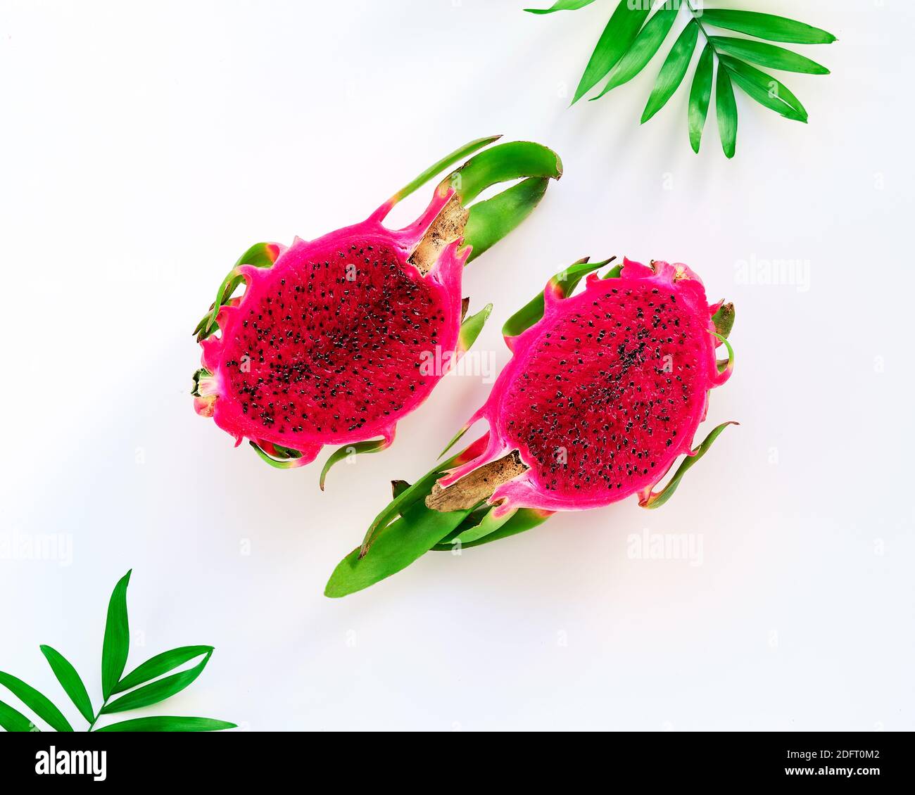 Fresh pink dragon fruit, pitaya or pitahaya, on white background with ...