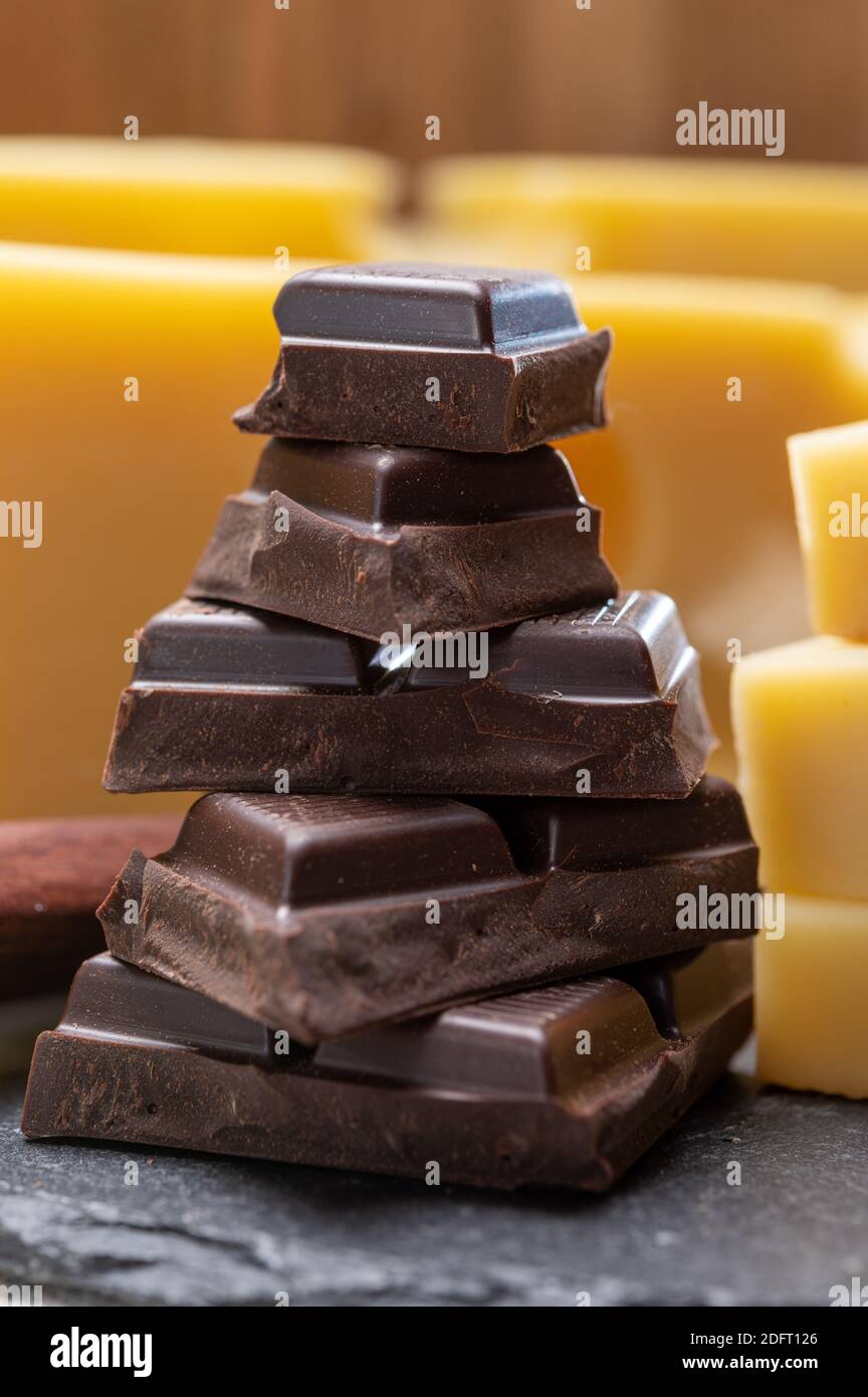 Tasty Swiss food, block of medium-hard yellow cheese emmental or ...