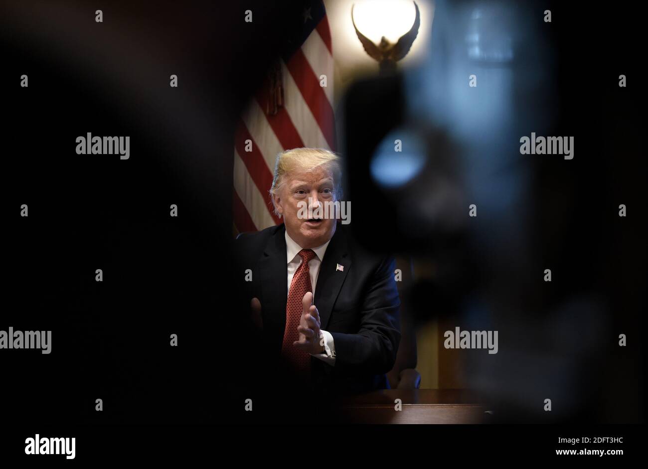 U.S. President Donald Trump talks to reporters during a cabinet meeting ...