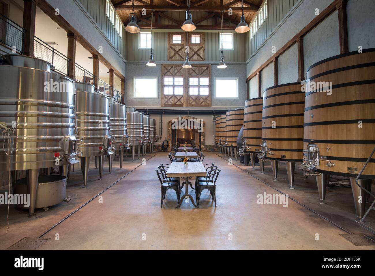 Rows of wine fermenters inside of a modern winery Stock Photo - Alamy