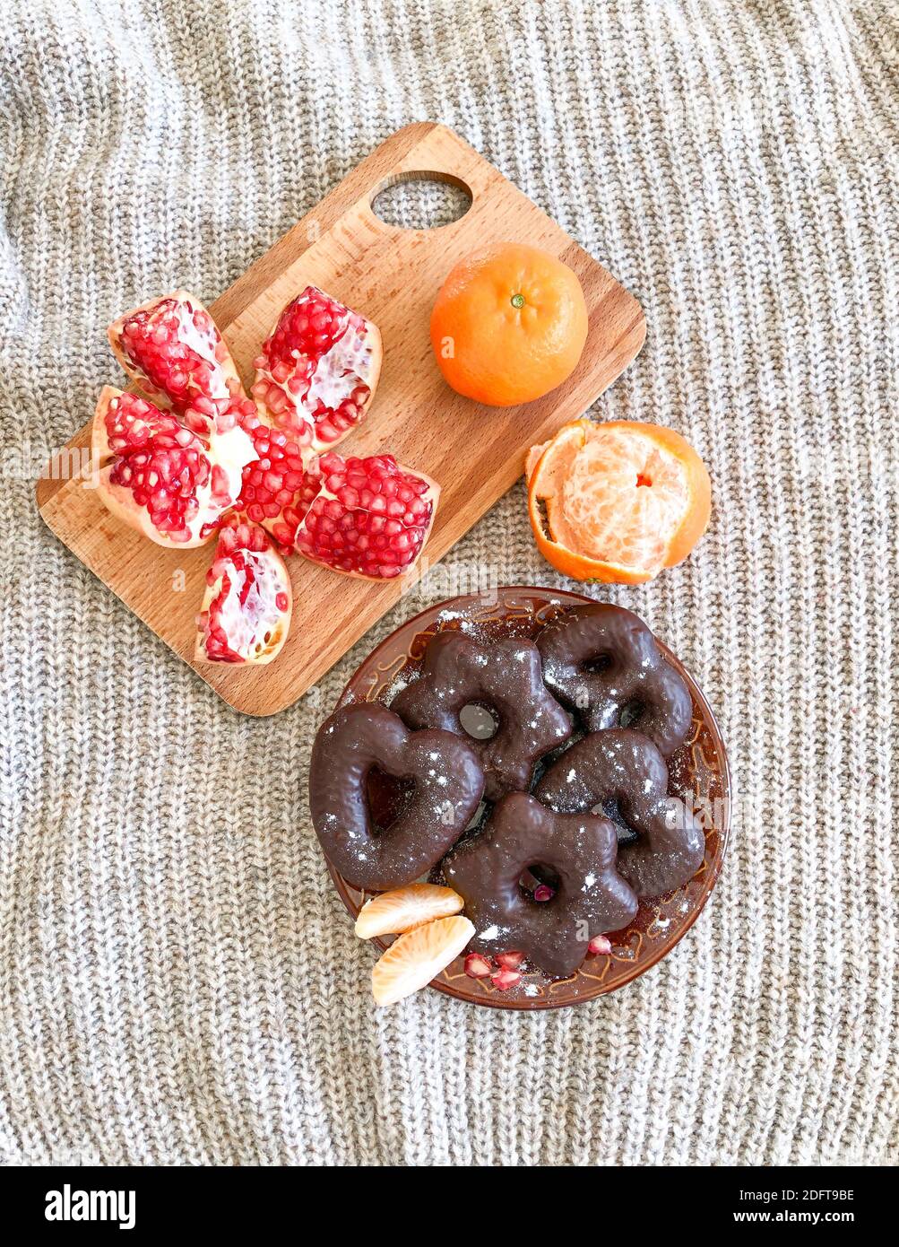 Homemade gingerbread covered with chocolate on brown ceramic plate with ...