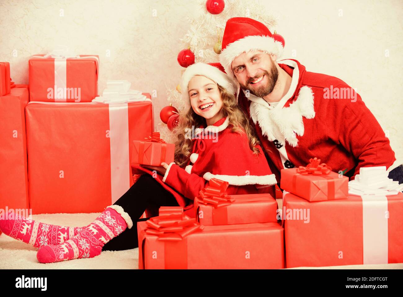 Family christmas celebration traditions. Dad in santa costume with ...