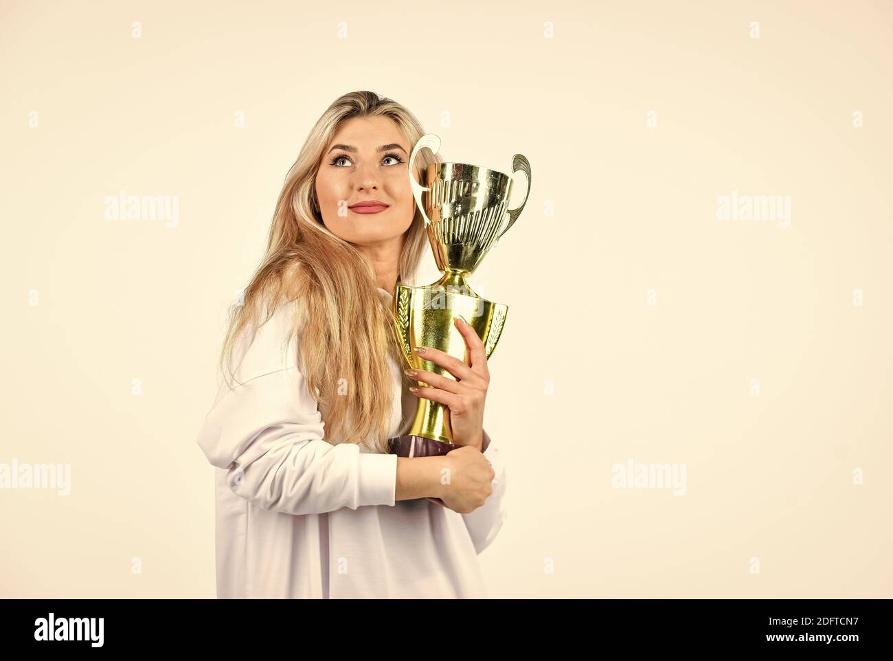 Girl showing winning trophy hi-res stock photography and images - Alamy