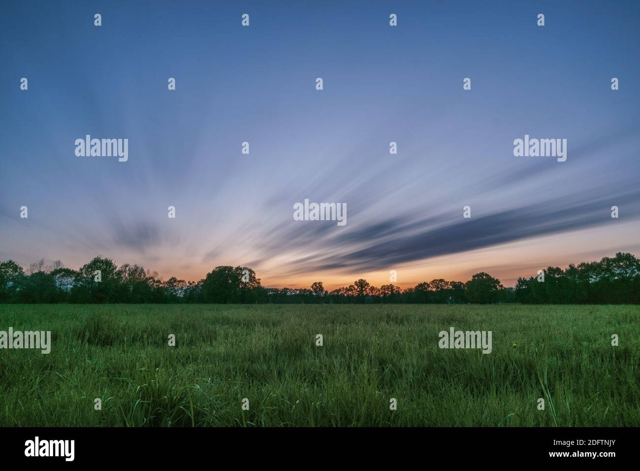 Landscape in Munsterland Germany at evening sky with moving clouds in ...