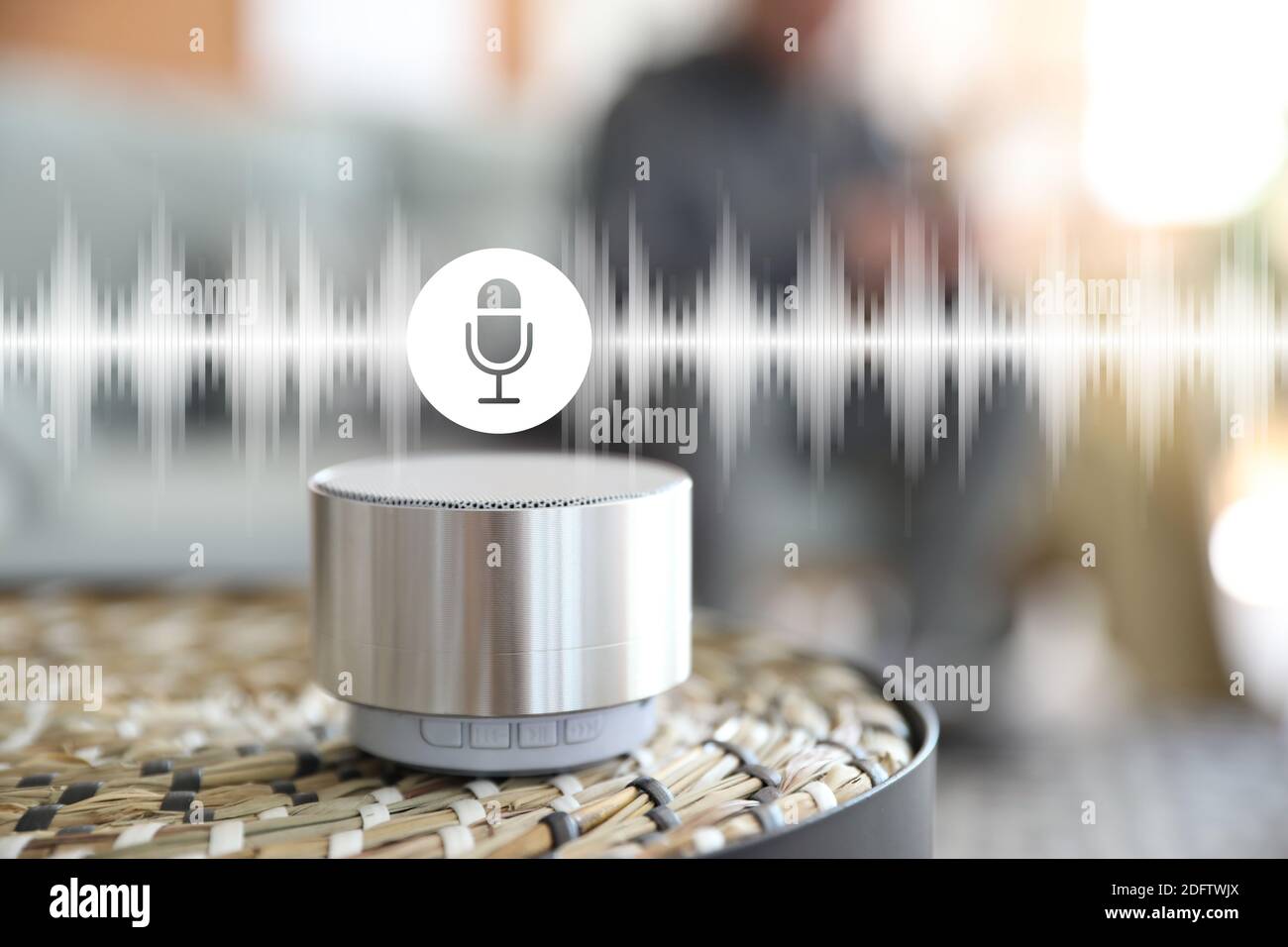 Smart home assistant device on table in room Stock Photo - Alamy