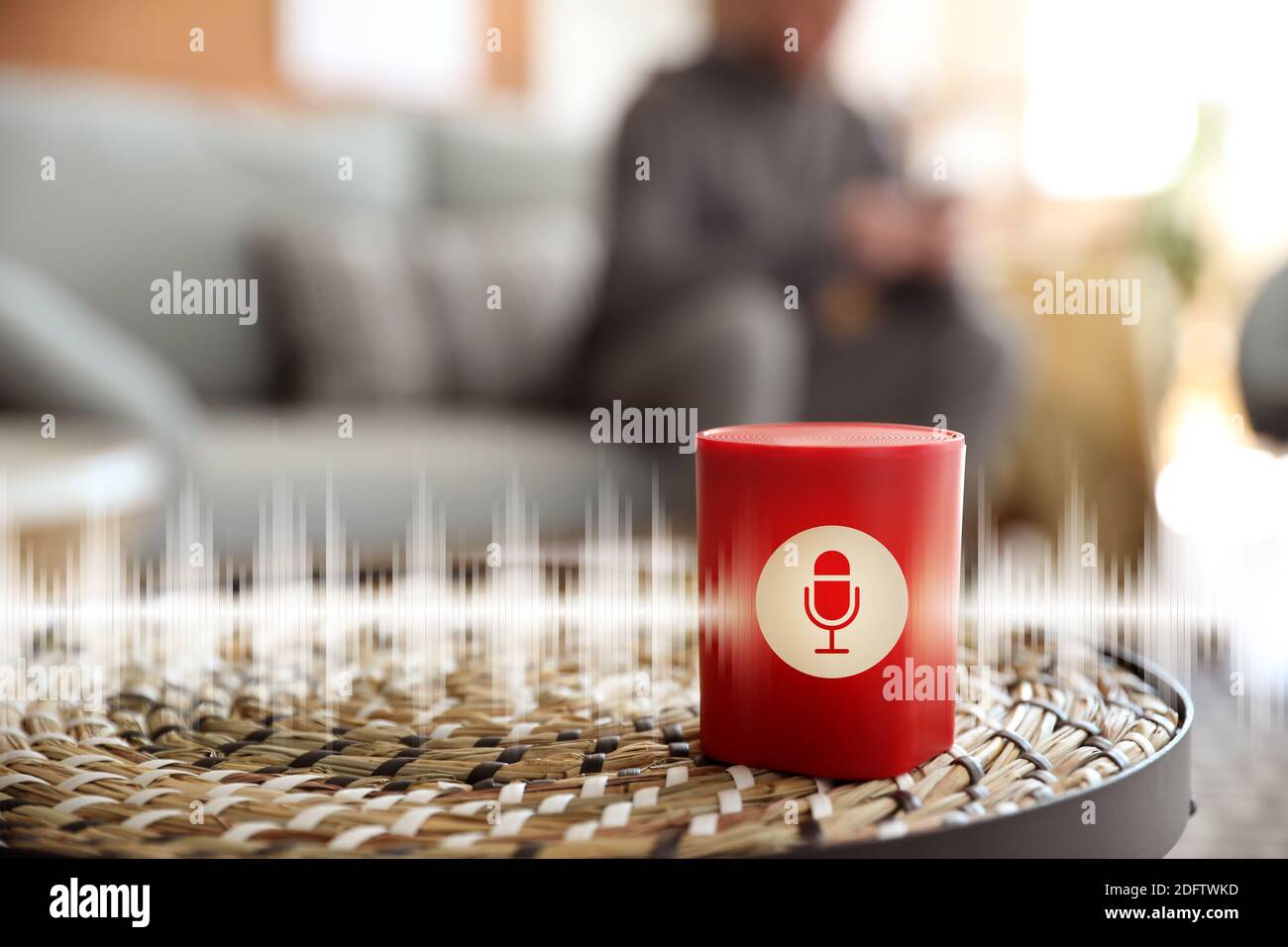 Smart home assistant device on table in room Stock Photo - Alamy