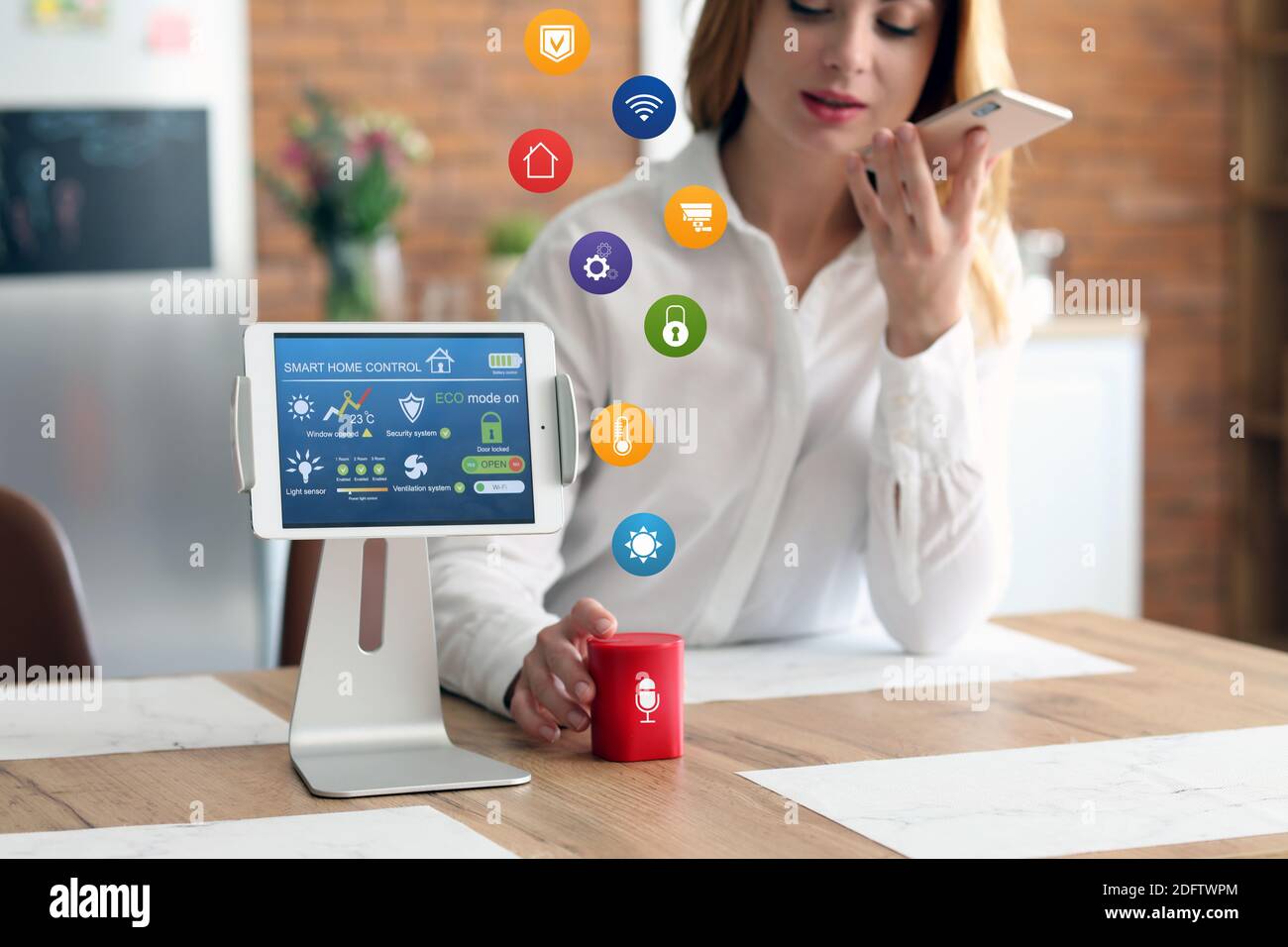 Woman using application of smart home automation Stock Photo - Alamy