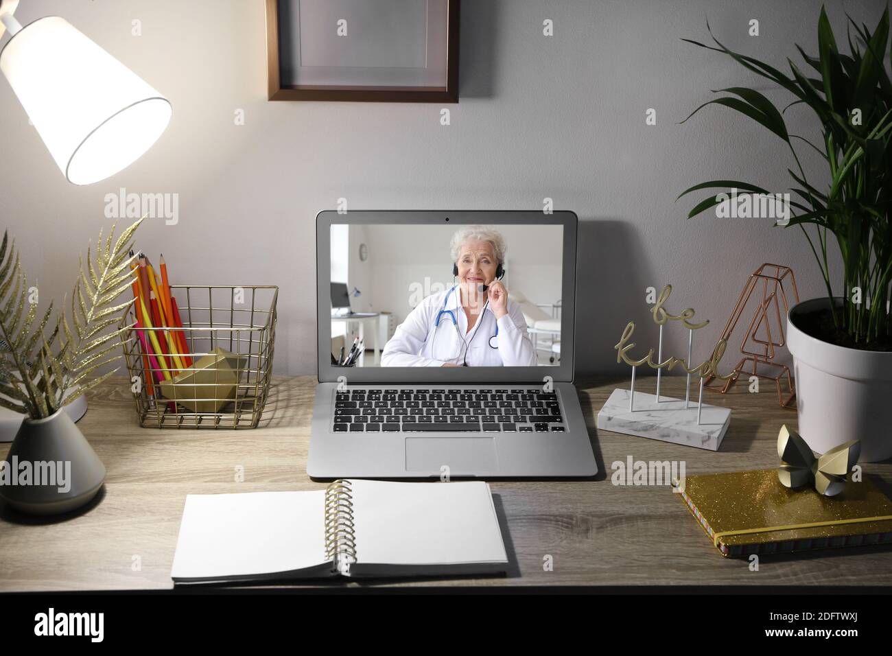 Laptop with female doctor on screen in room. Concept of telemedicine ...