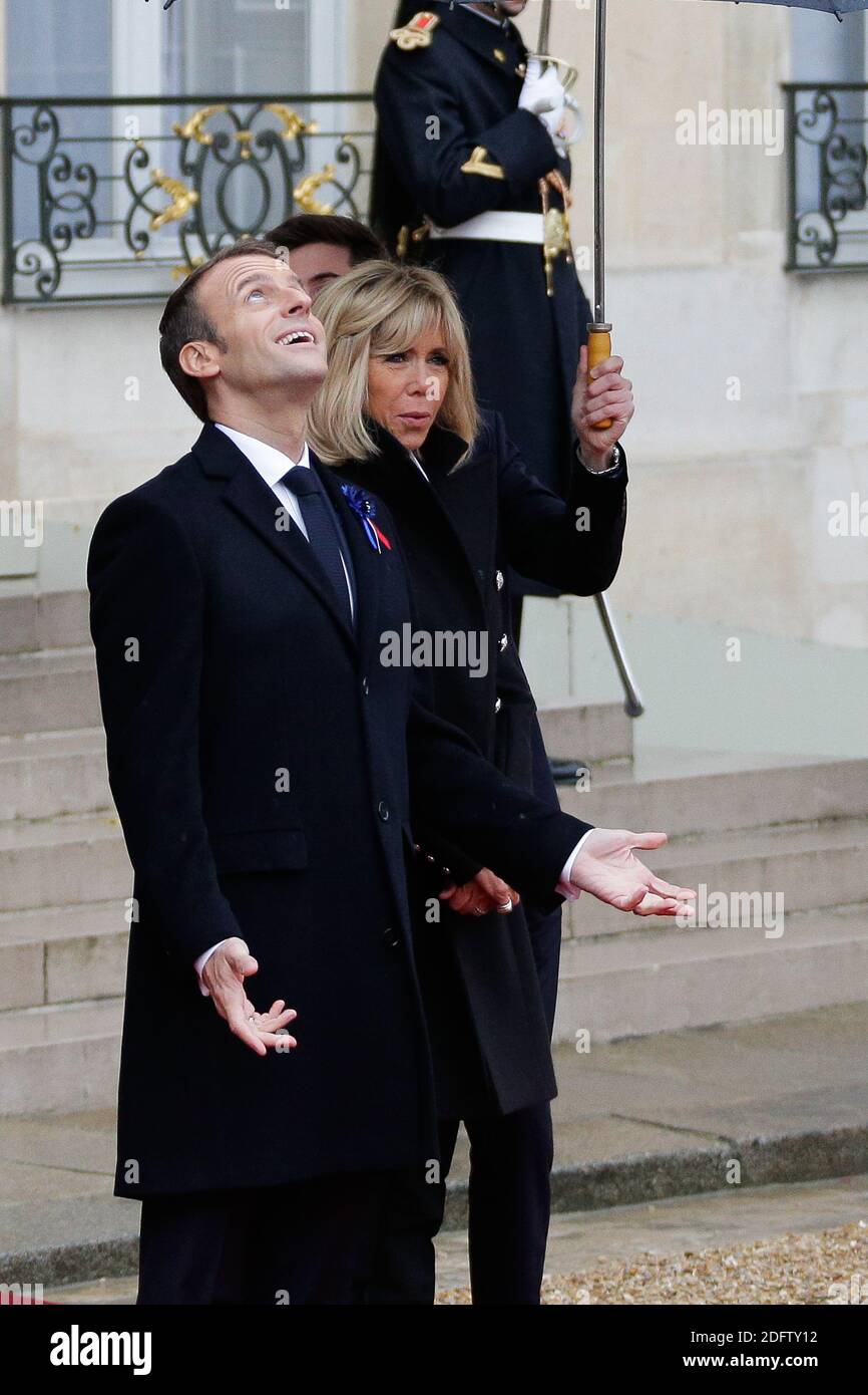 French President Emmanuel Macron and his wife Brigitte Macron welcome ...