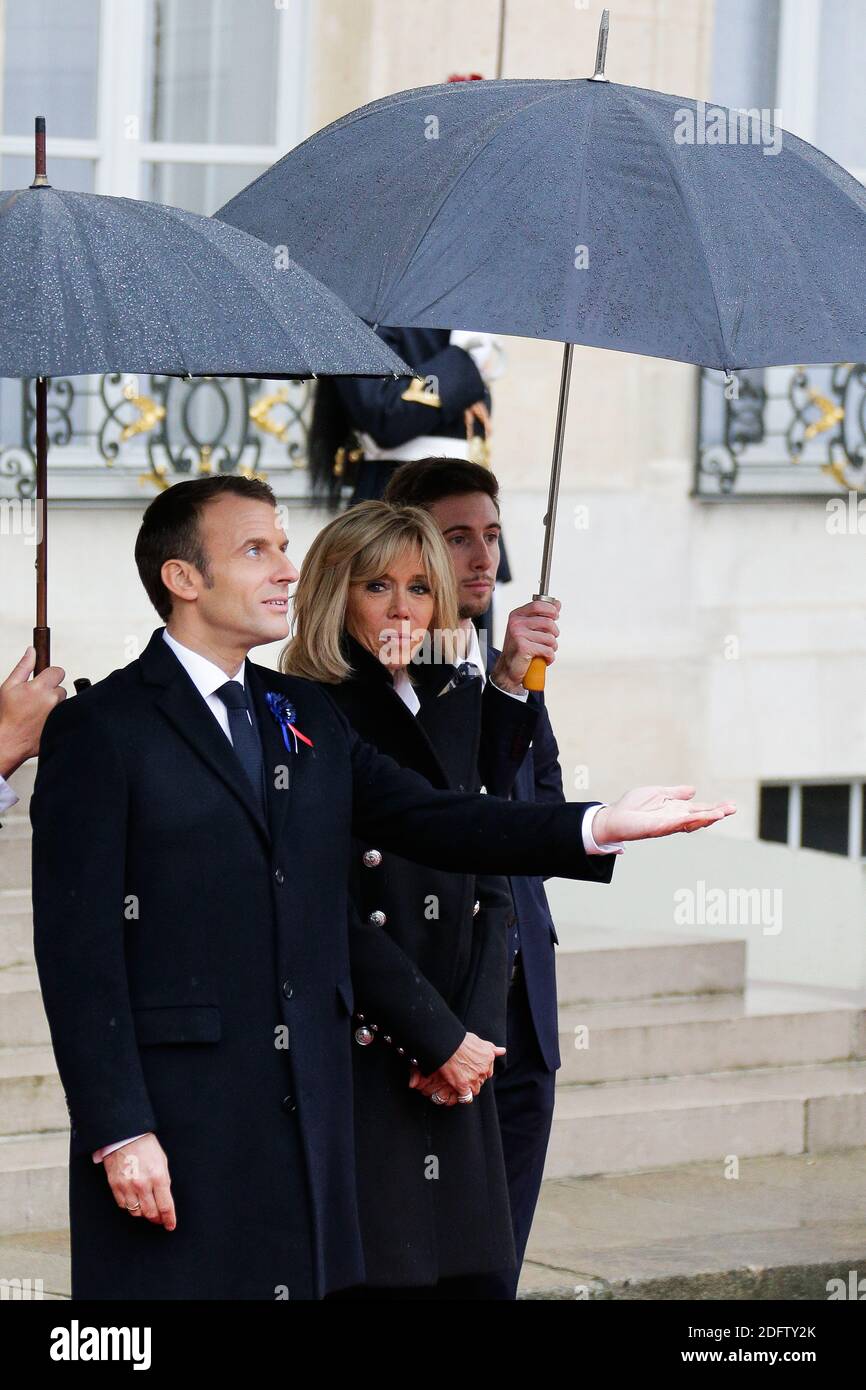 French President Emmanuel Macron and his wife Brigitte Macron welcome ...