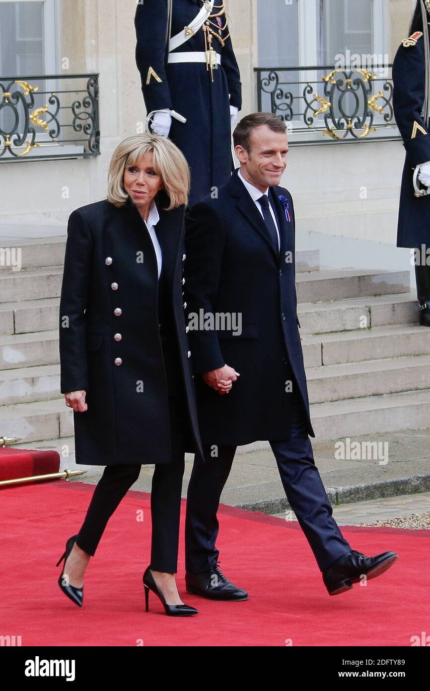 French President Emmanuel Macron and his wife Brigitte Macron welcome ...