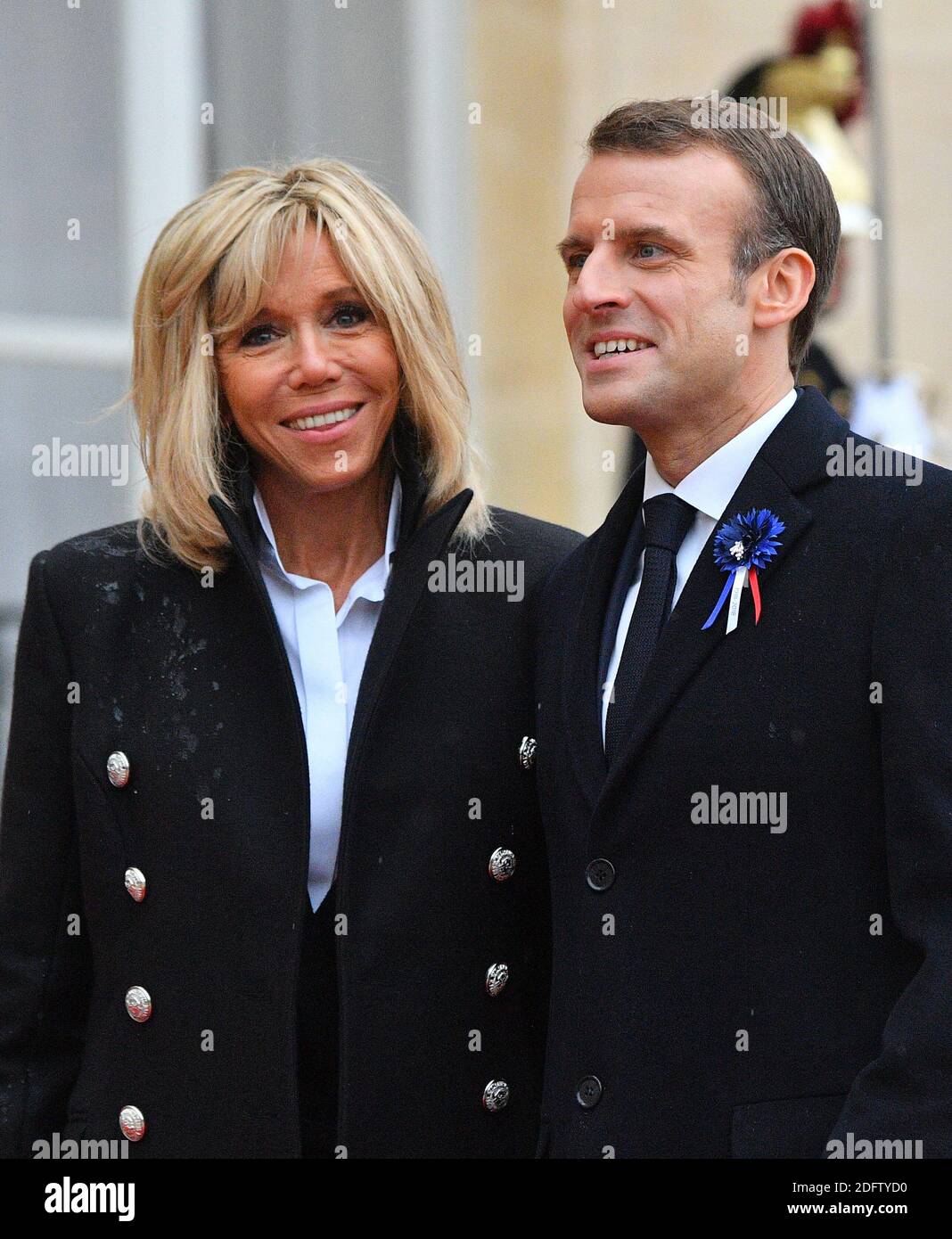 French President Emmanuel Macron and his wife Brigitte Macron receive ...
