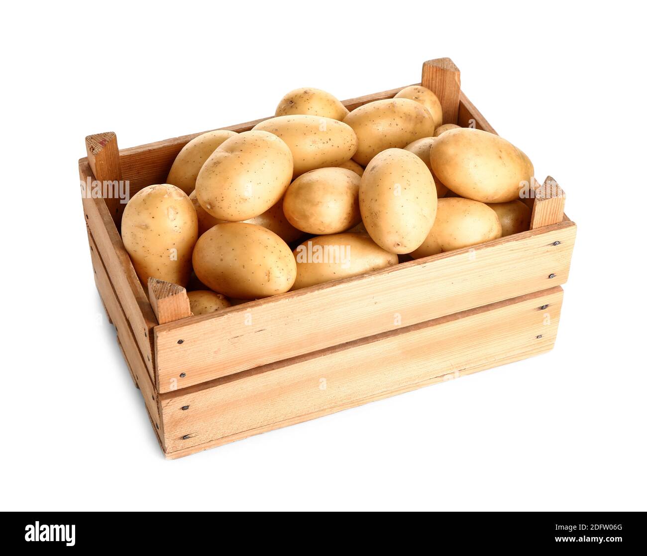 Wooden crate with raw potatoes on white background Stock Photo - Alamy