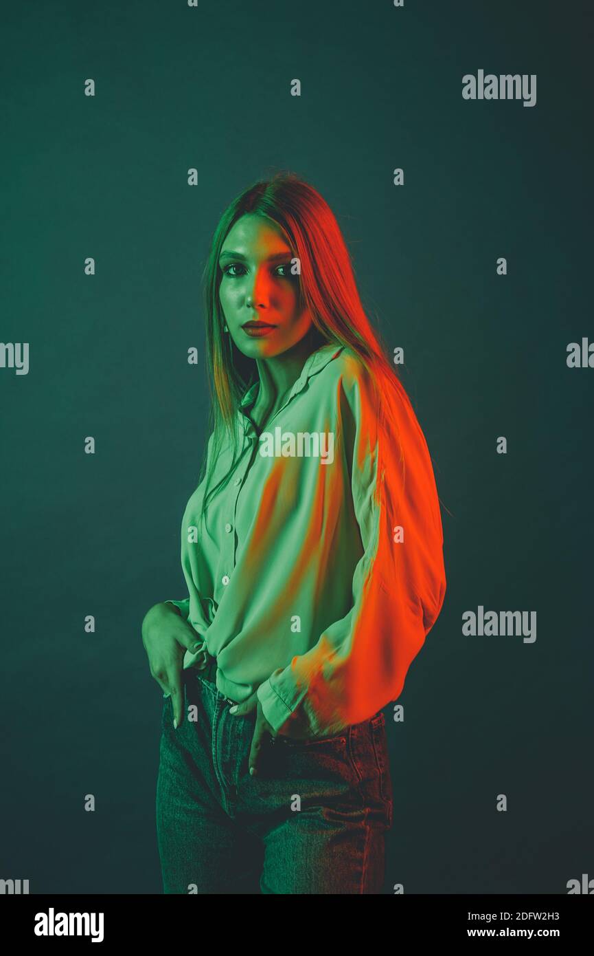 Creative portrait of a beautiful female model close-up. orange and ...