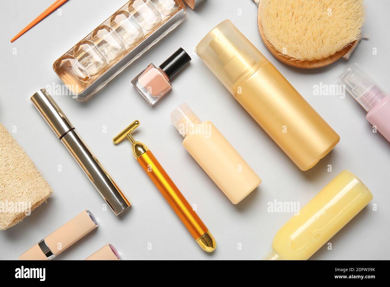 Travel cosmetics kit on light background Stock Photo - Alamy