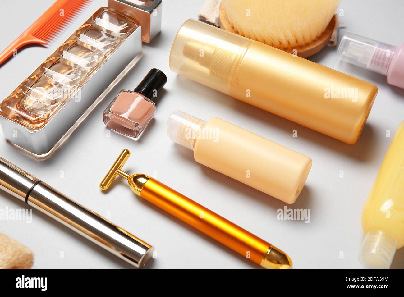 Travel cosmetics kit on light background Stock Photo - Alamy