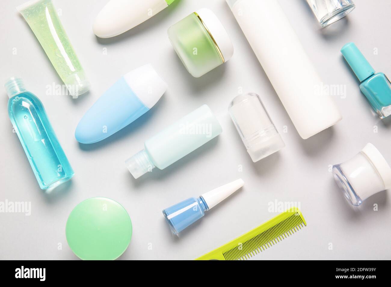 Travel cosmetics kit on light background Stock Photo - Alamy