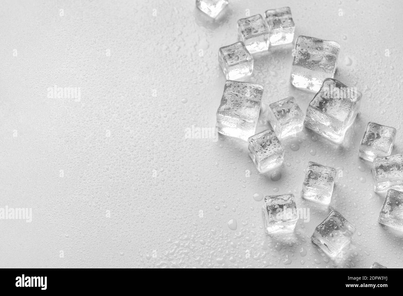 Ice cubes on light background Stock Photo - Alamy