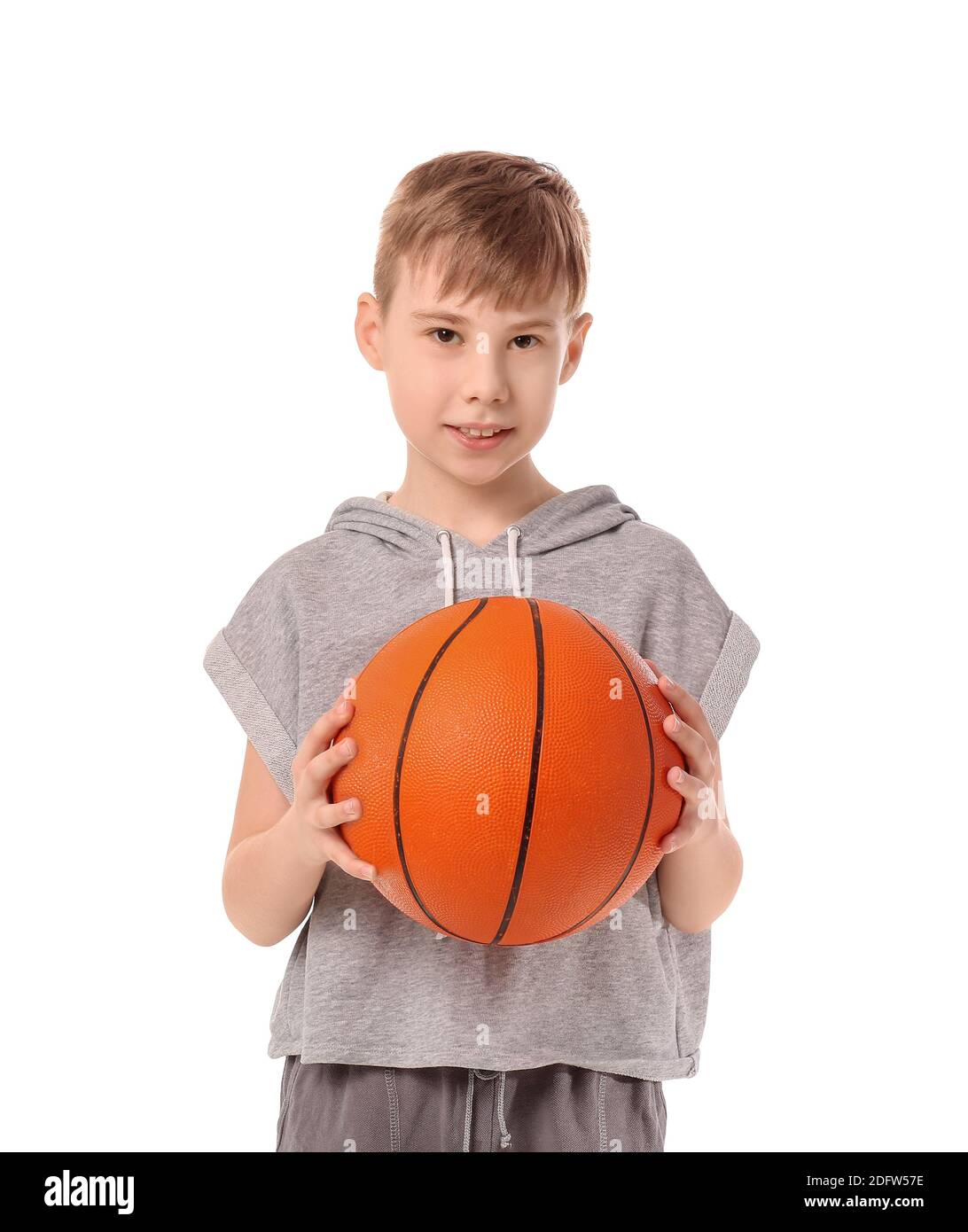 Cute boy with basketball on white background Stock Photo - Alamy