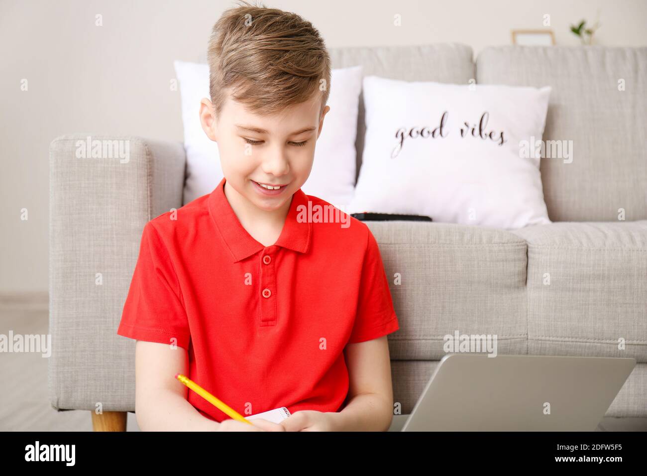 Cute boy doing homework at home Stock Photo - Alamy
