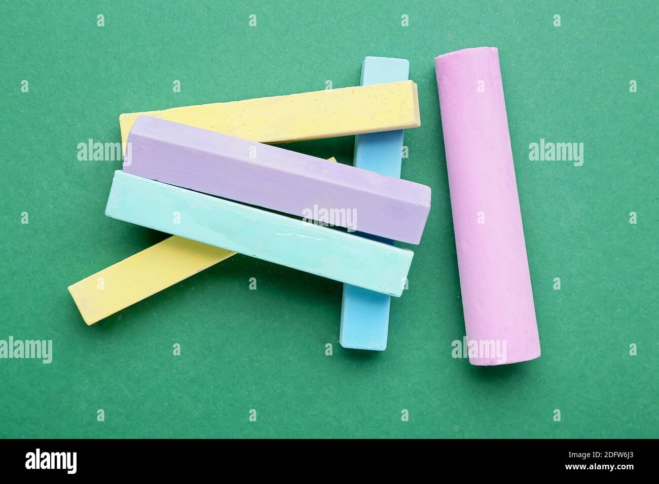 Colorful chalks on color background Stock Photo - Alamy