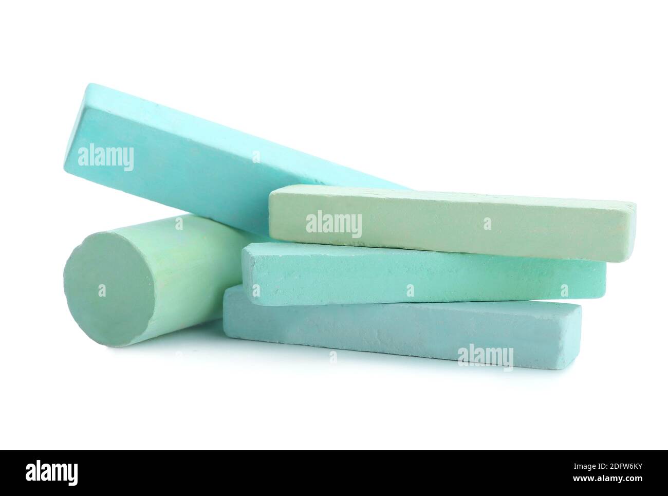 Green chalks on white background Stock Photo - Alamy