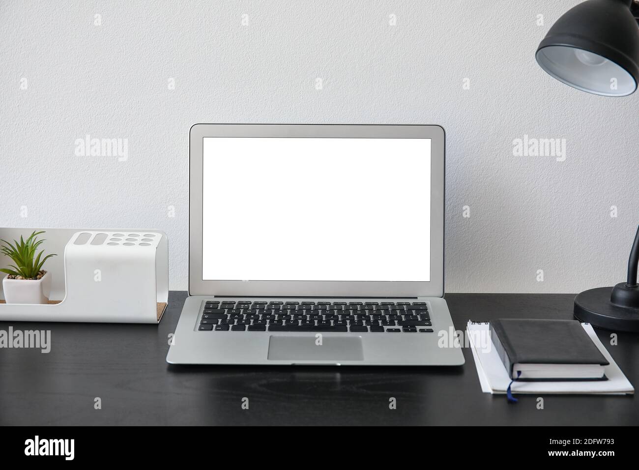 Comfortable workplace with modern laptop in office Stock Photo - Alamy
