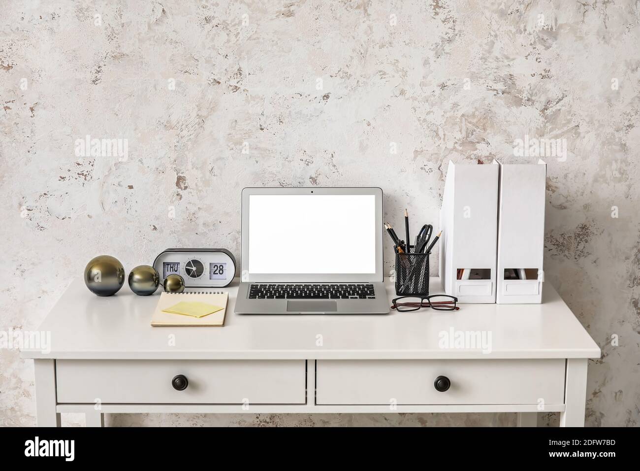 Comfortable workplace with modern laptop in room Stock Photo - Alamy