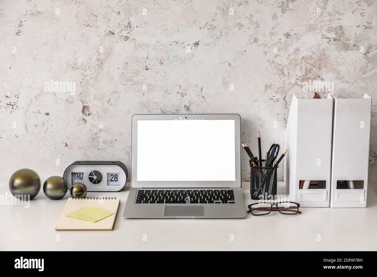 Comfortable workplace with modern laptop in room Stock Photo - Alamy