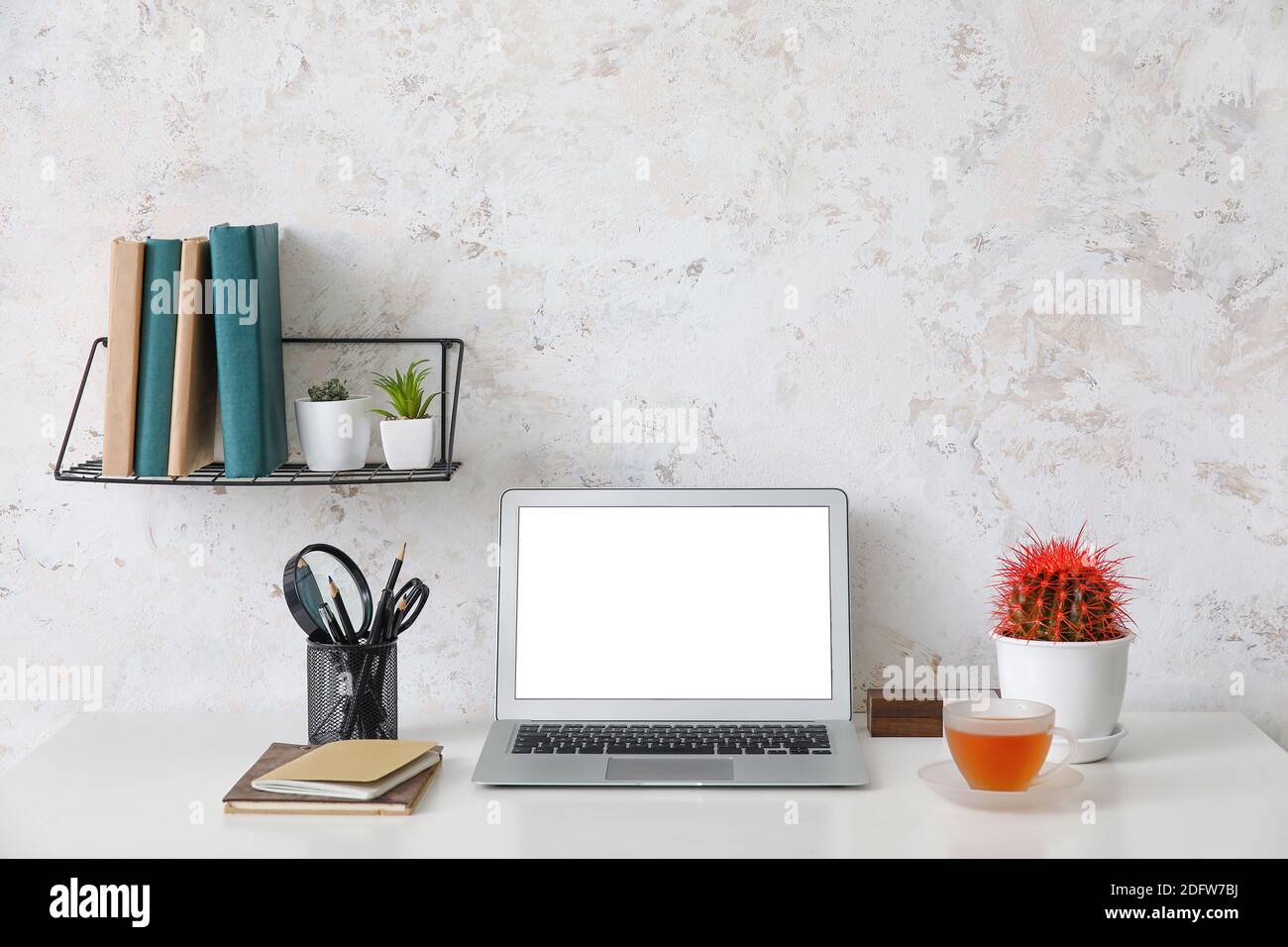 Comfortable workplace with modern laptop in room Stock Photo - Alamy