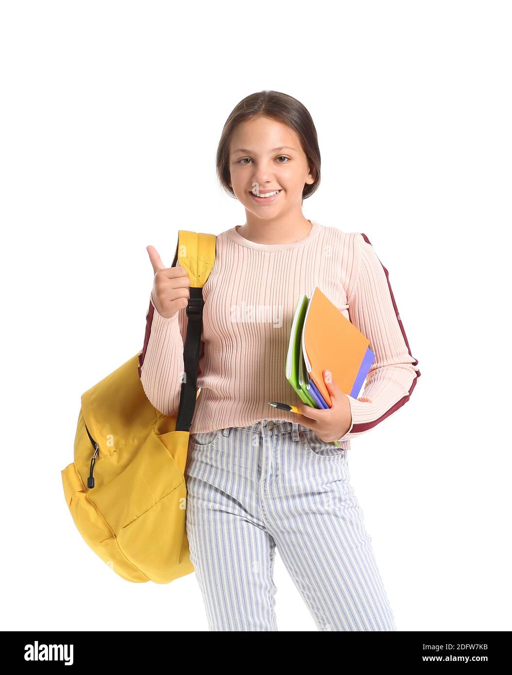 Teenage schoolgirl showing thumb-up gesture on white background Stock ...