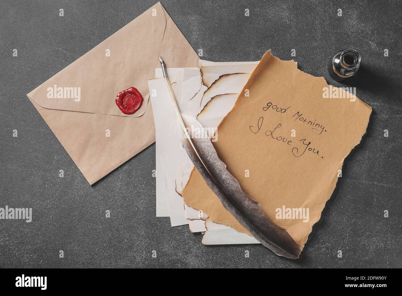 Vintage letter and envelope with feather pen on table Stock Photo - Alamy