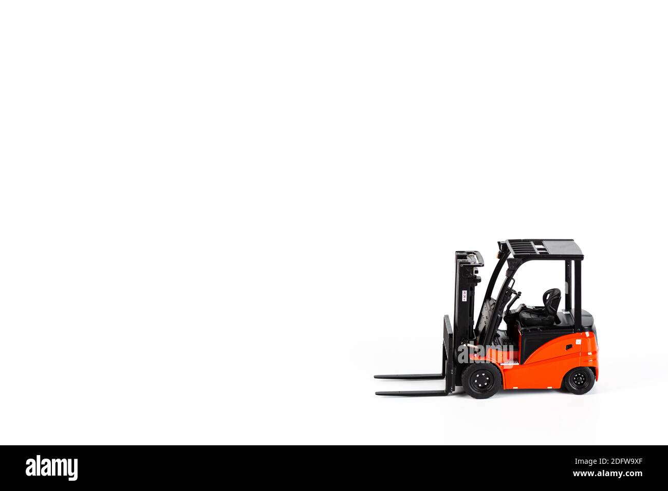 Red toy forklift loader isolated on white background. Copy Space for ...