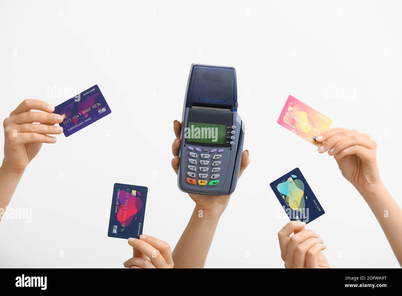 Female hands with credit cards and payment terminal on white background ...