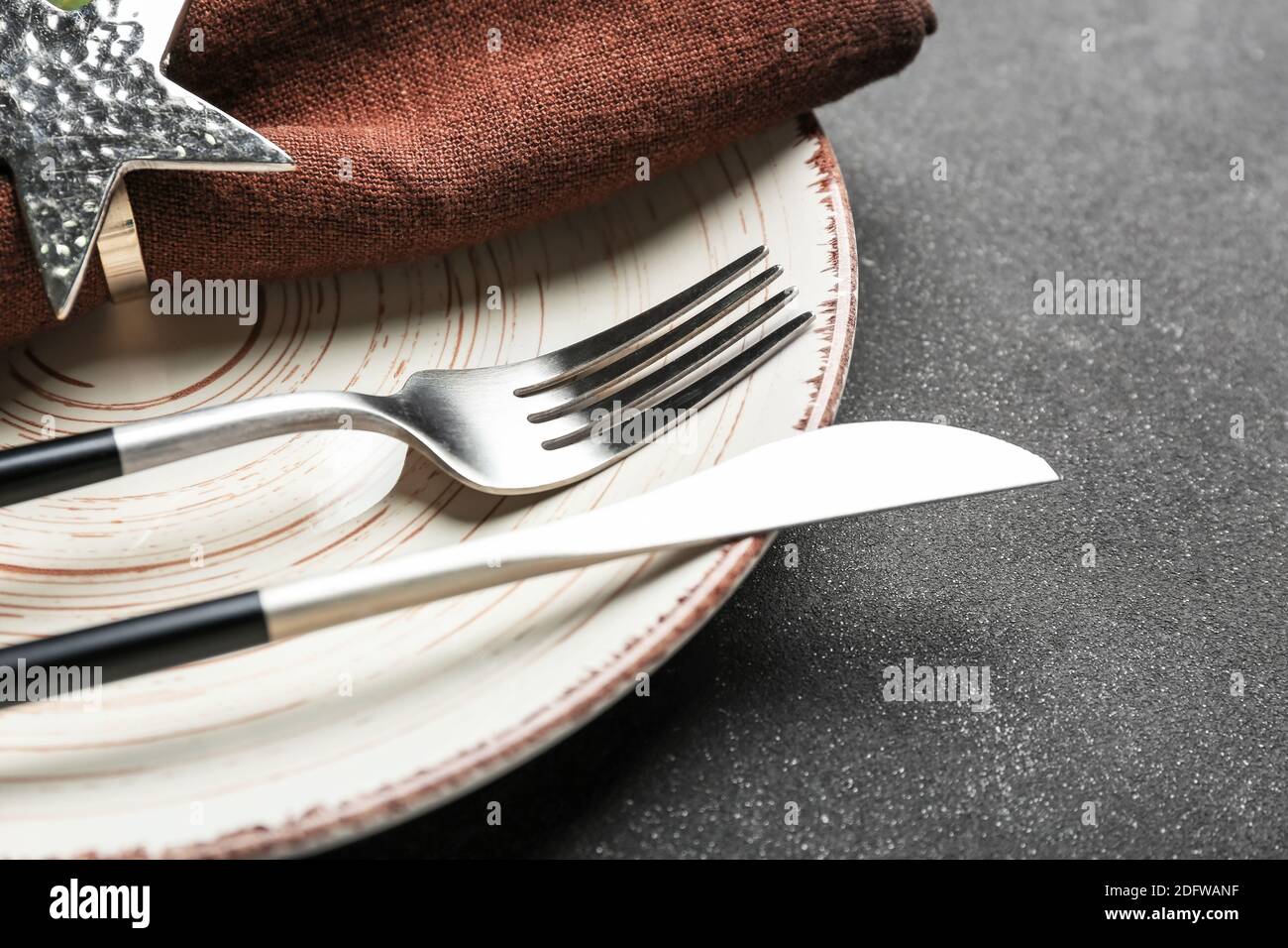 Beautiful table setting on dark background Stock Photo - Alamy