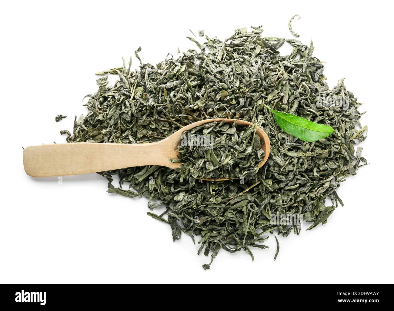 Dry green tea on white background Stock Photo - Alamy
