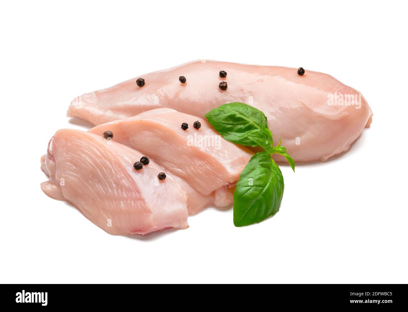 Raw chicken fillet with basil and black pepper on white background ...