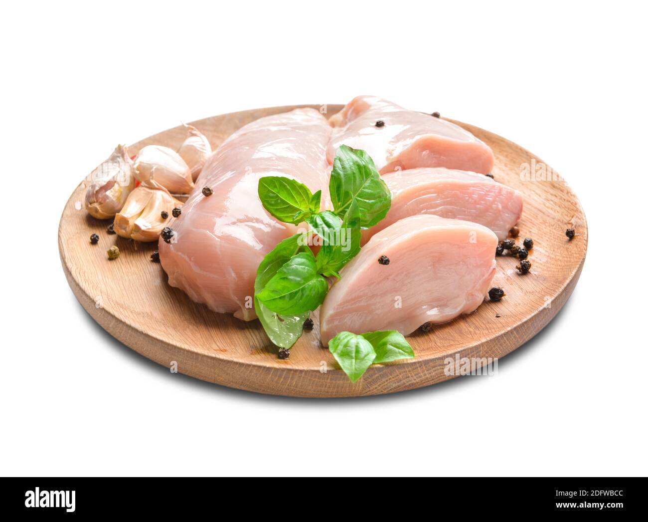 Board with raw chicken fillet on white background Stock Photo - Alamy