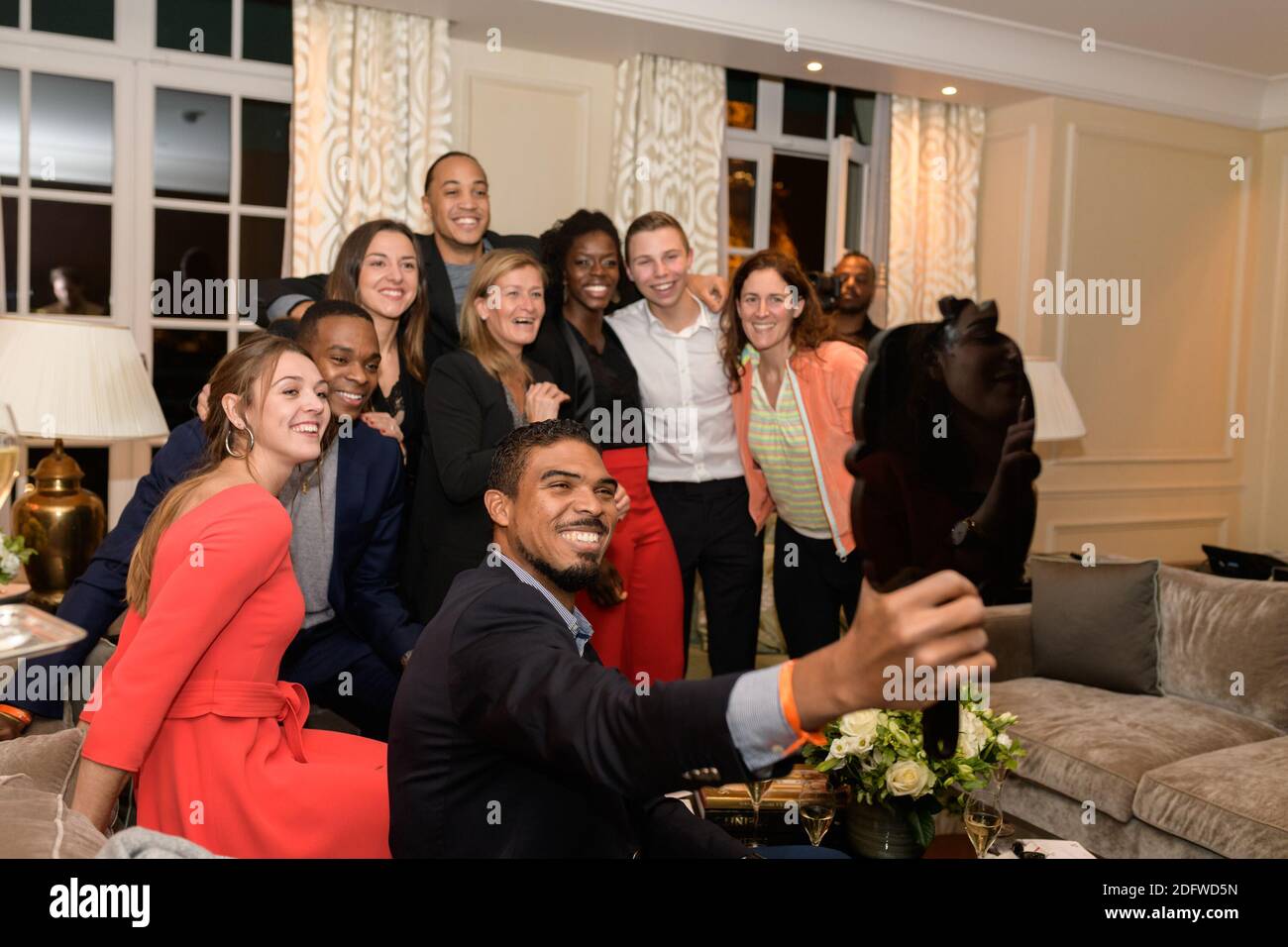 French fencer Yannick Borel (FG) making a selfie with invited athletes ...